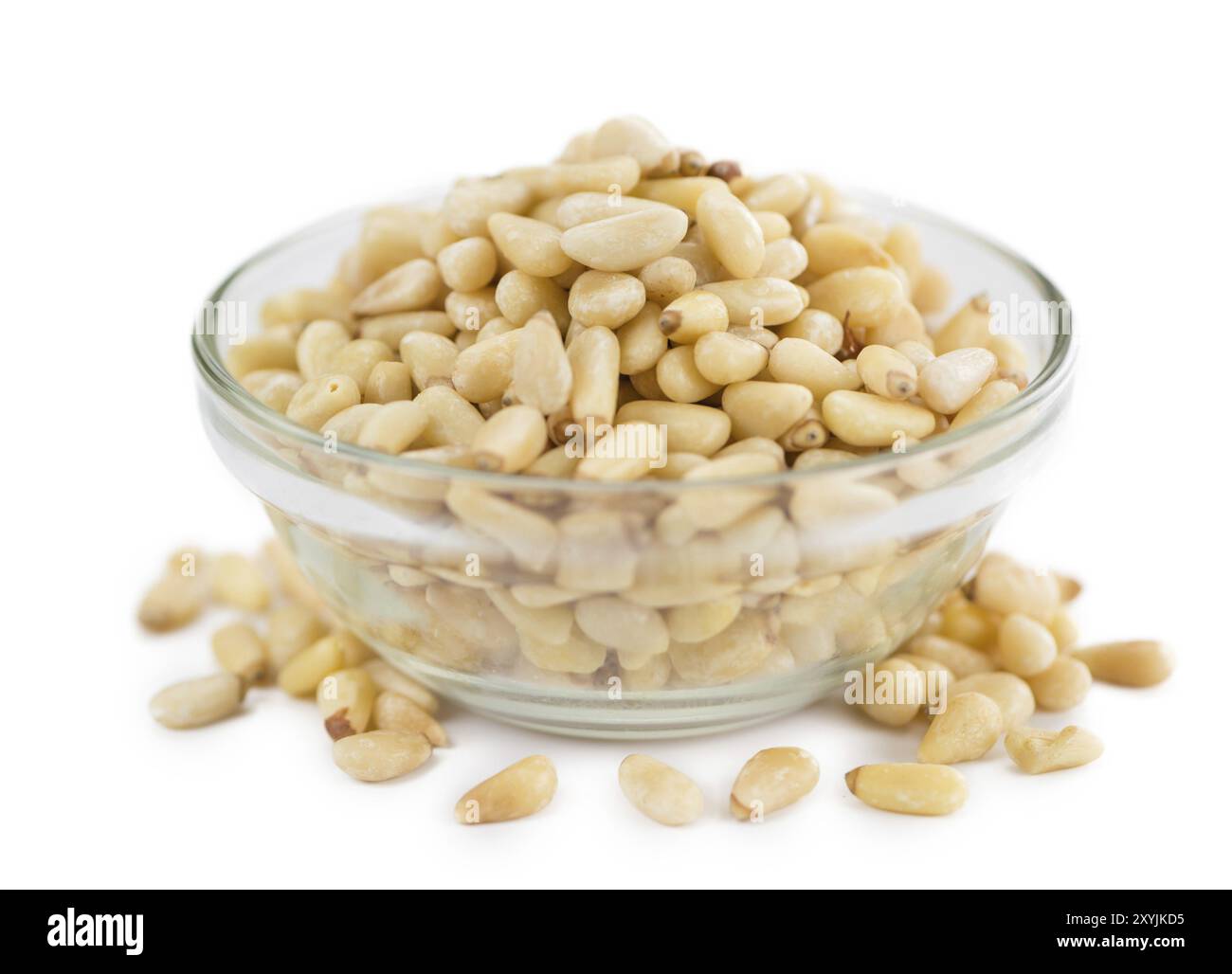 Portion of Pine Nuts (as close-up shot) isolated on white background ...