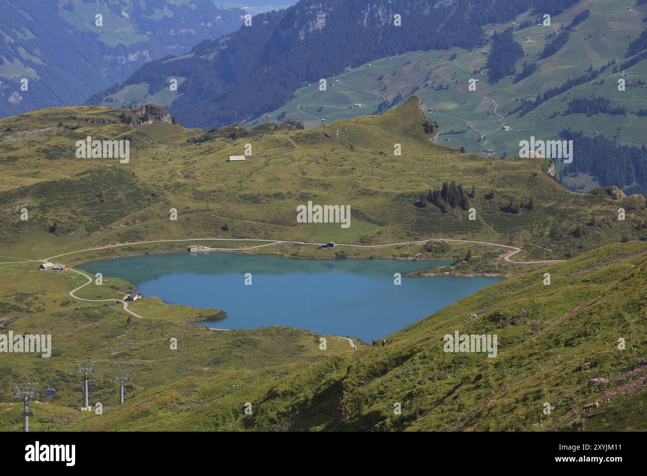 Lake half way up on mount Titlis, Engelberg. Turquoise lake Trubsee ...