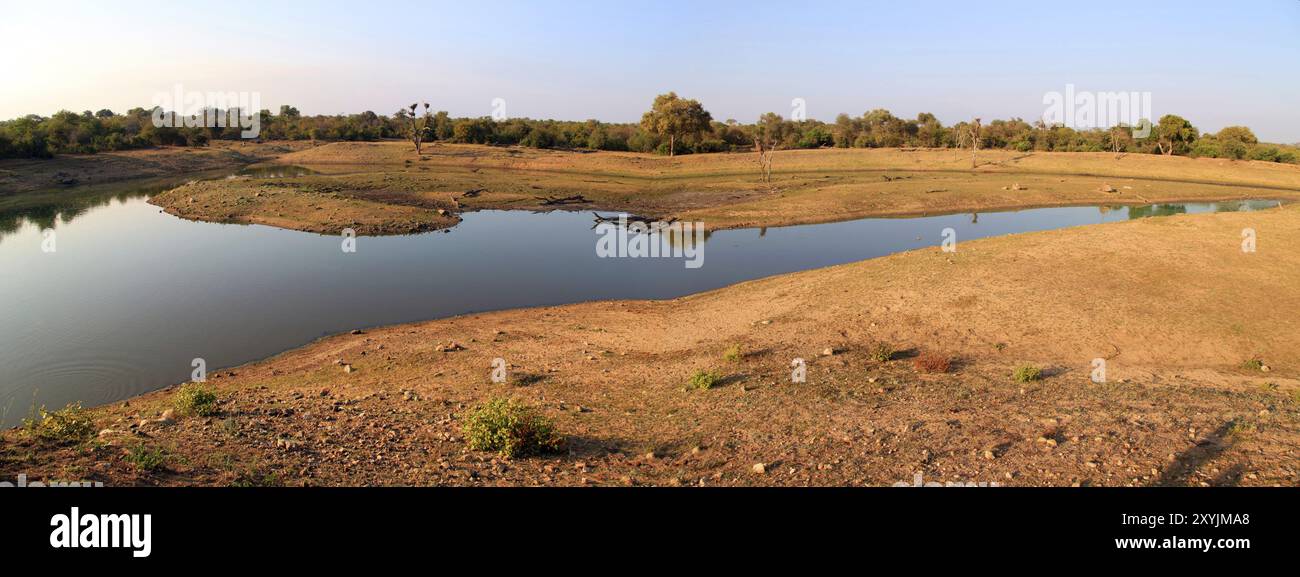 African evening mood at the waterhole Stock Photo - Alamy