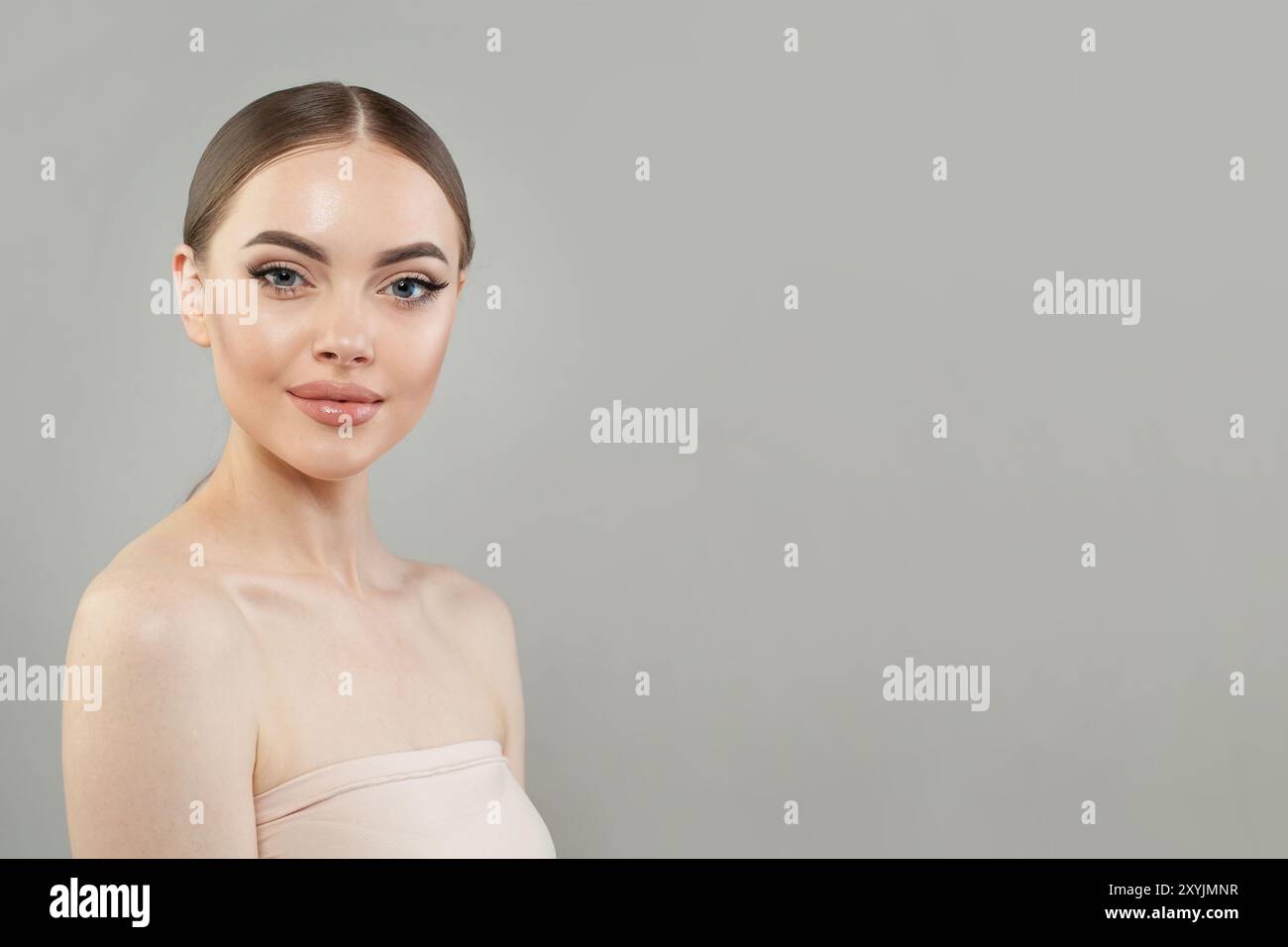 Perfect happy young female model with natural make-up, shiny clean skin ...