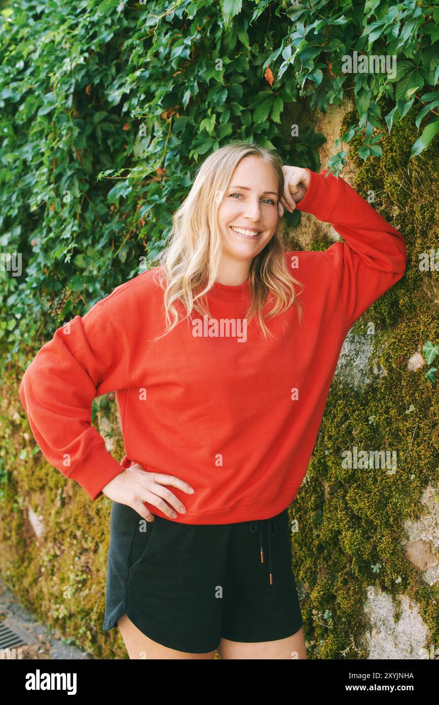 Portrait of beautiful 40 - 45 year old woman with blond hair posing ...