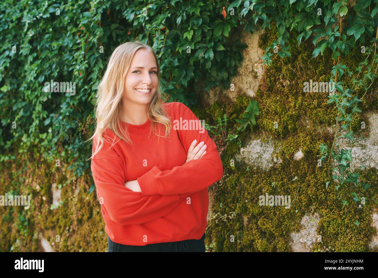Portrait of beautiful 40 - 45 year old woman with blond hair posing ...