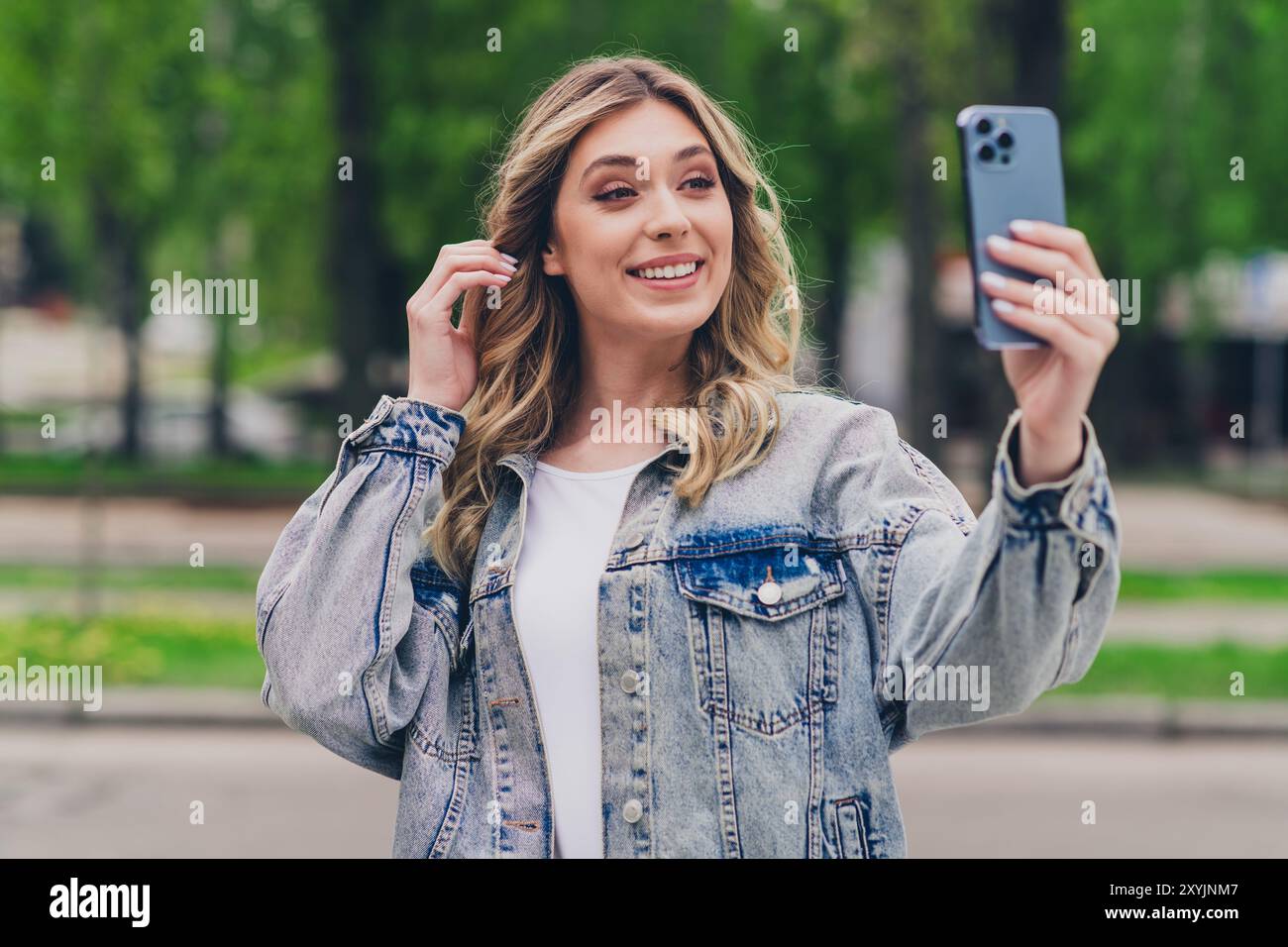 Portrait of nice young girl smart phone make selfie wear denim jacket ...