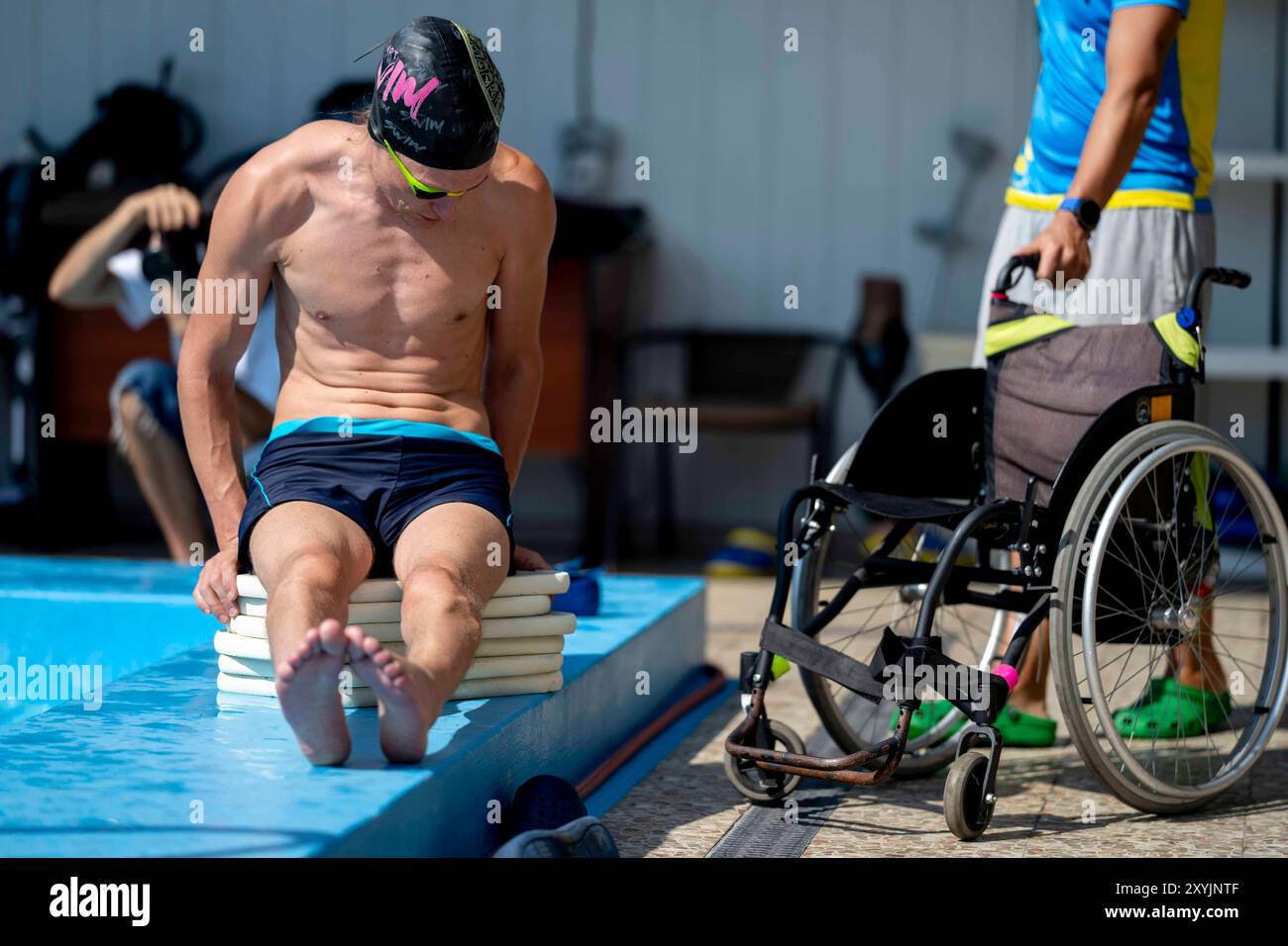 Man and his wheelchair seen at 1000 meters swimming competition by One ...