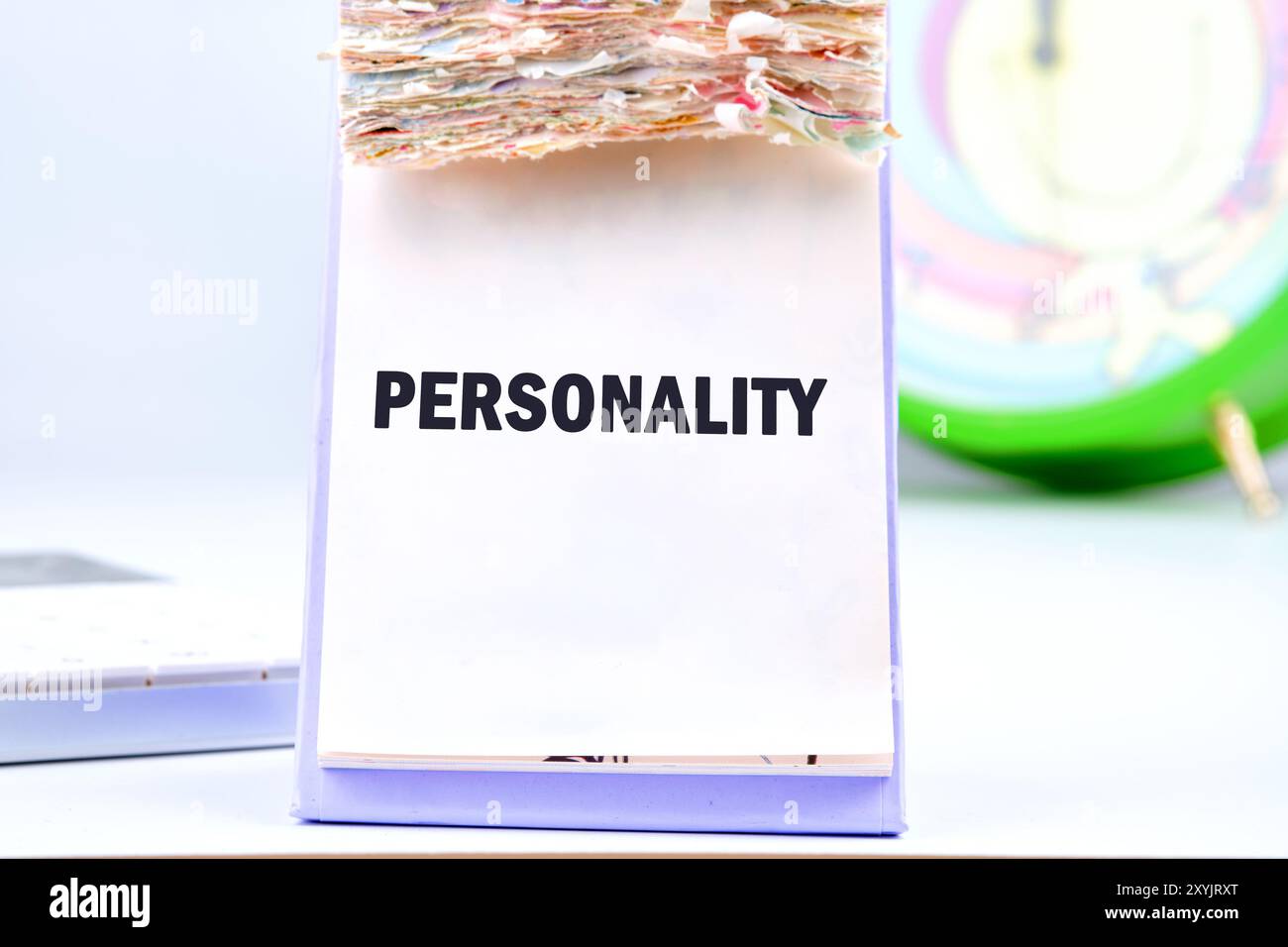 Concept word PERSONALITY in a desktop calendar on a light background ...