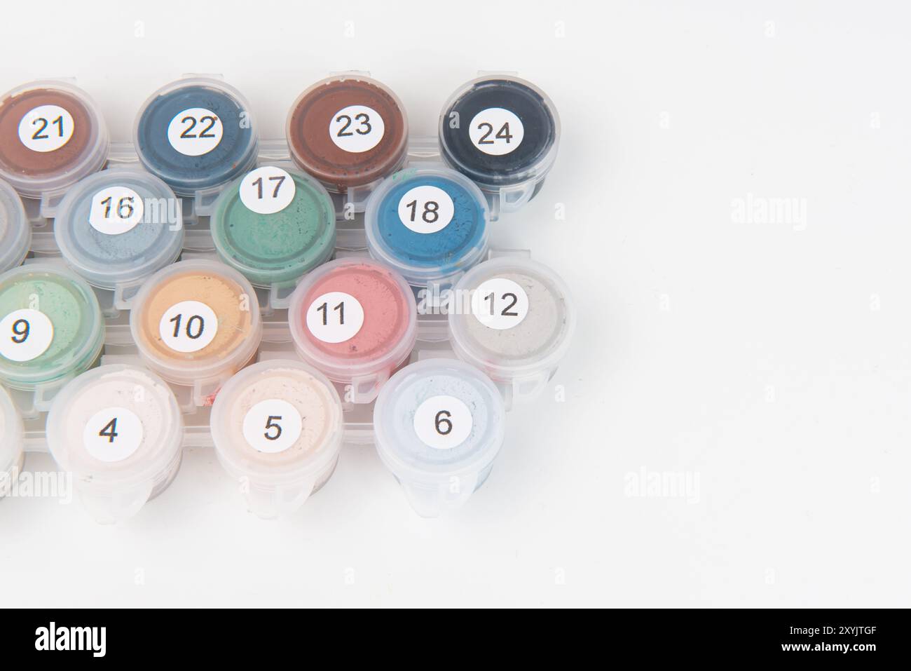Drawing a picture by numbers with acrylic paints on canvas Stock Photo ...