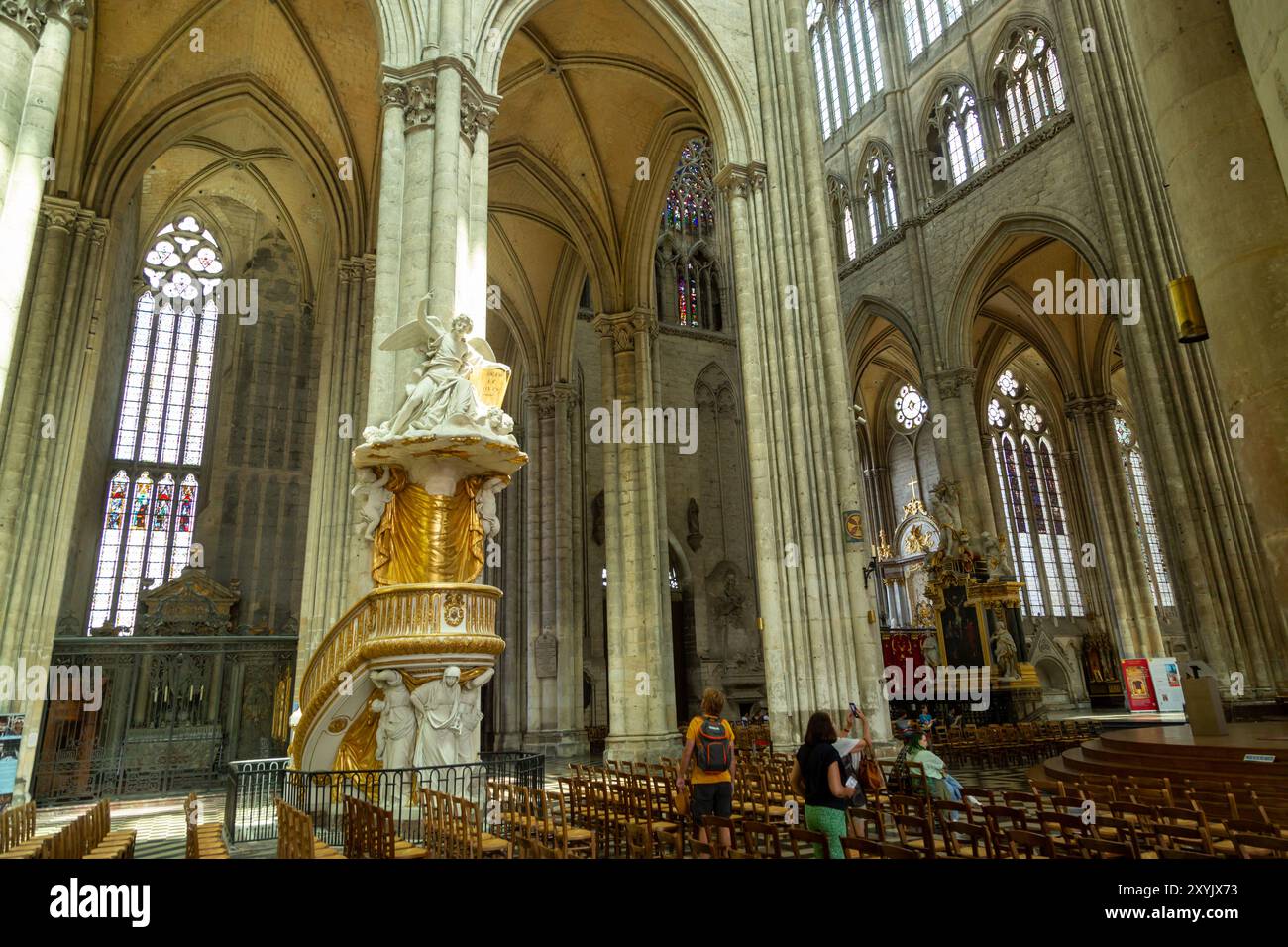 The Baroque pulpit. Made of marble and wood shrouded in gold, the three ...