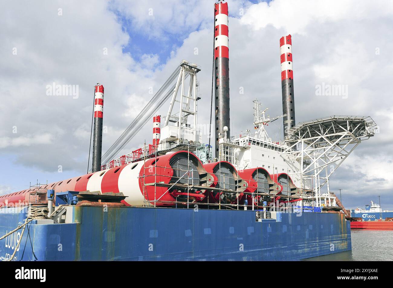 Construction vessel with jack-up-legs in the foreground. Construction ...