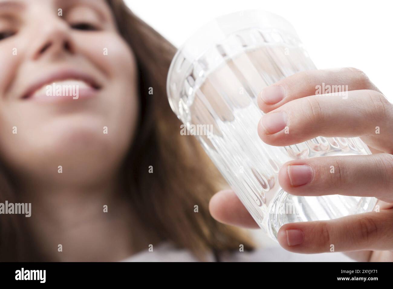 Female human hand holding liquid drink water glass Stock Photo - Alamy