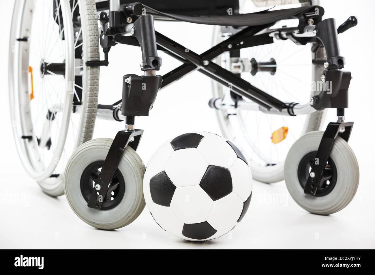 Wheelchair for invalid or disabled person and soccer ball white ...