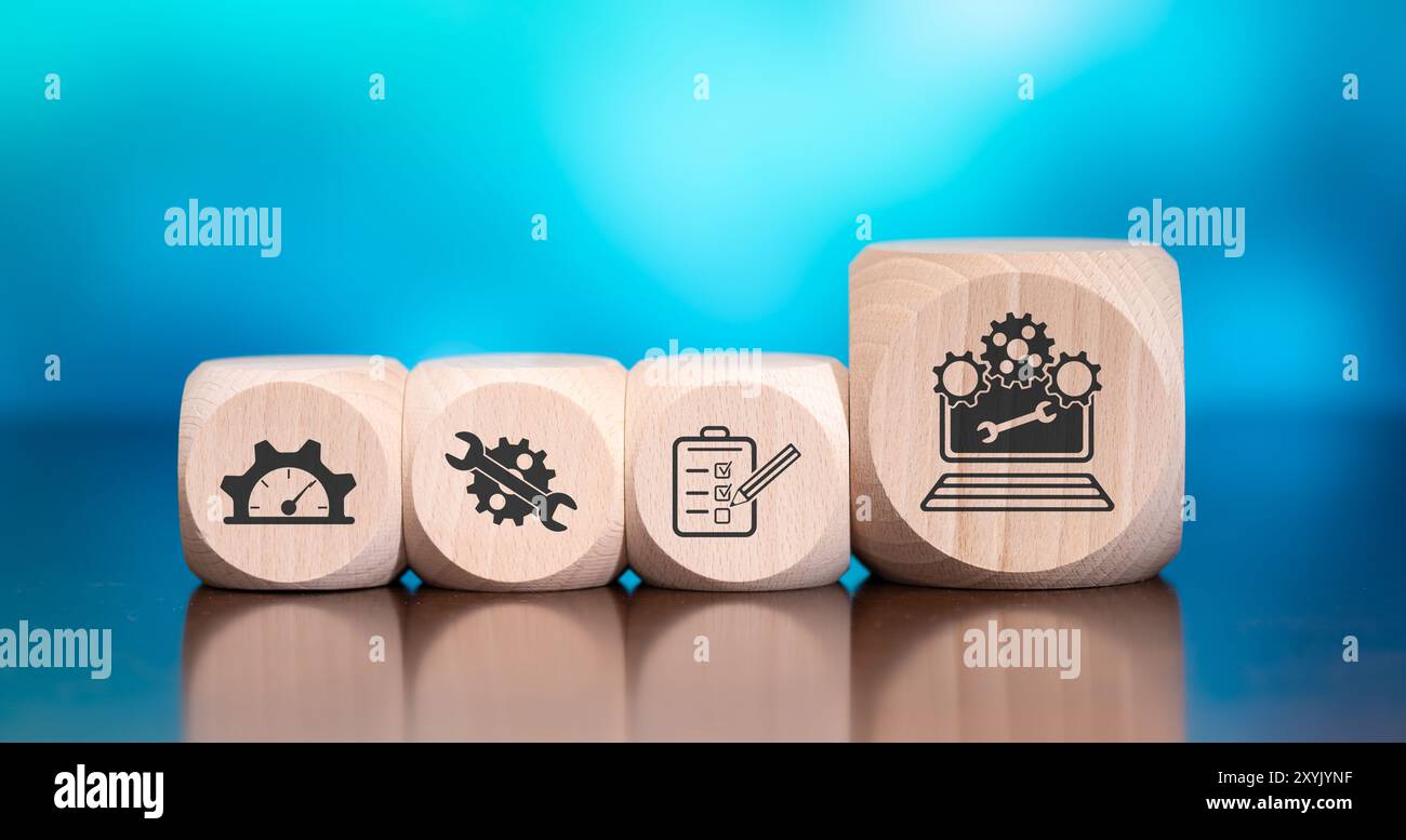 Wooden blocks with symbol of system maintenance concept on blue ...