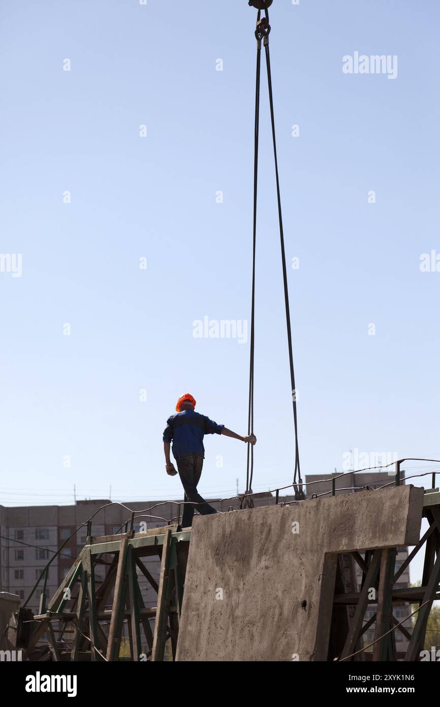 Worker men person building house construction site Stock Photo - Alamy