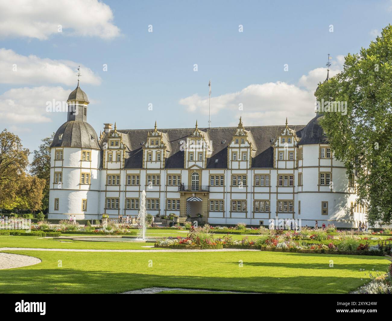 Magnificent historic castle with manicured green spaces and towers ...