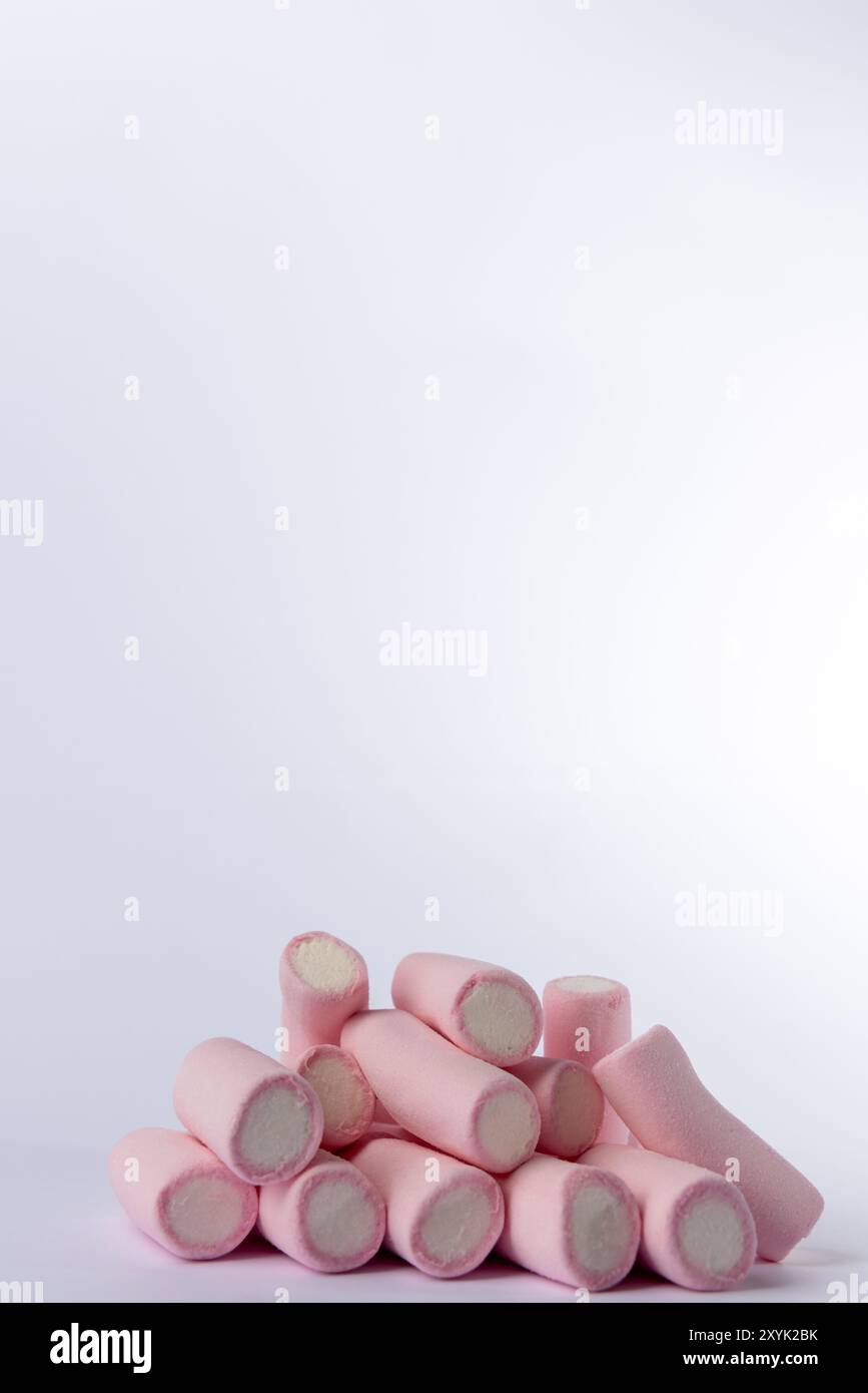 A neat stack of marshmallows is centered in the photo, creating a ...