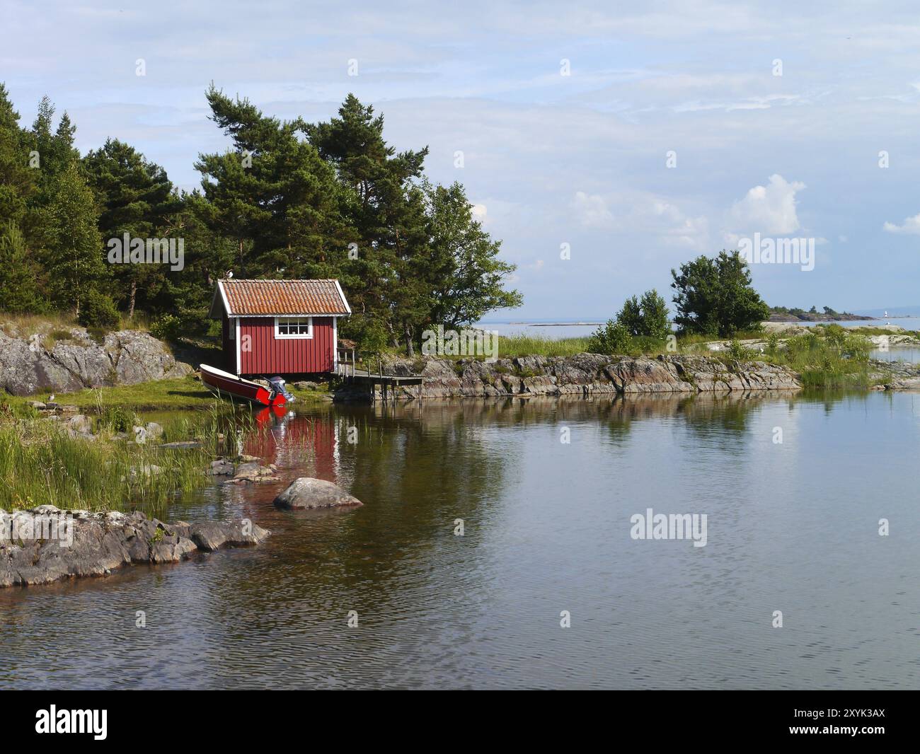 Wooden hut on the shore of Lake Vaenern Stock Photo - Alamy