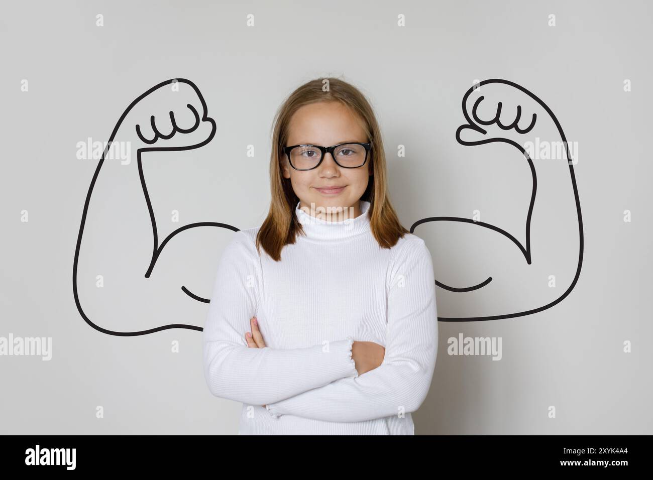 Clever young girl standing against white studio wall background with ...