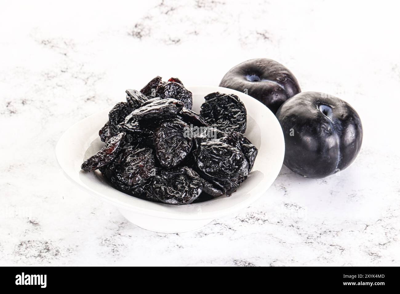 Dry sweet prunes in thw bowl Stock Photo - Alamy