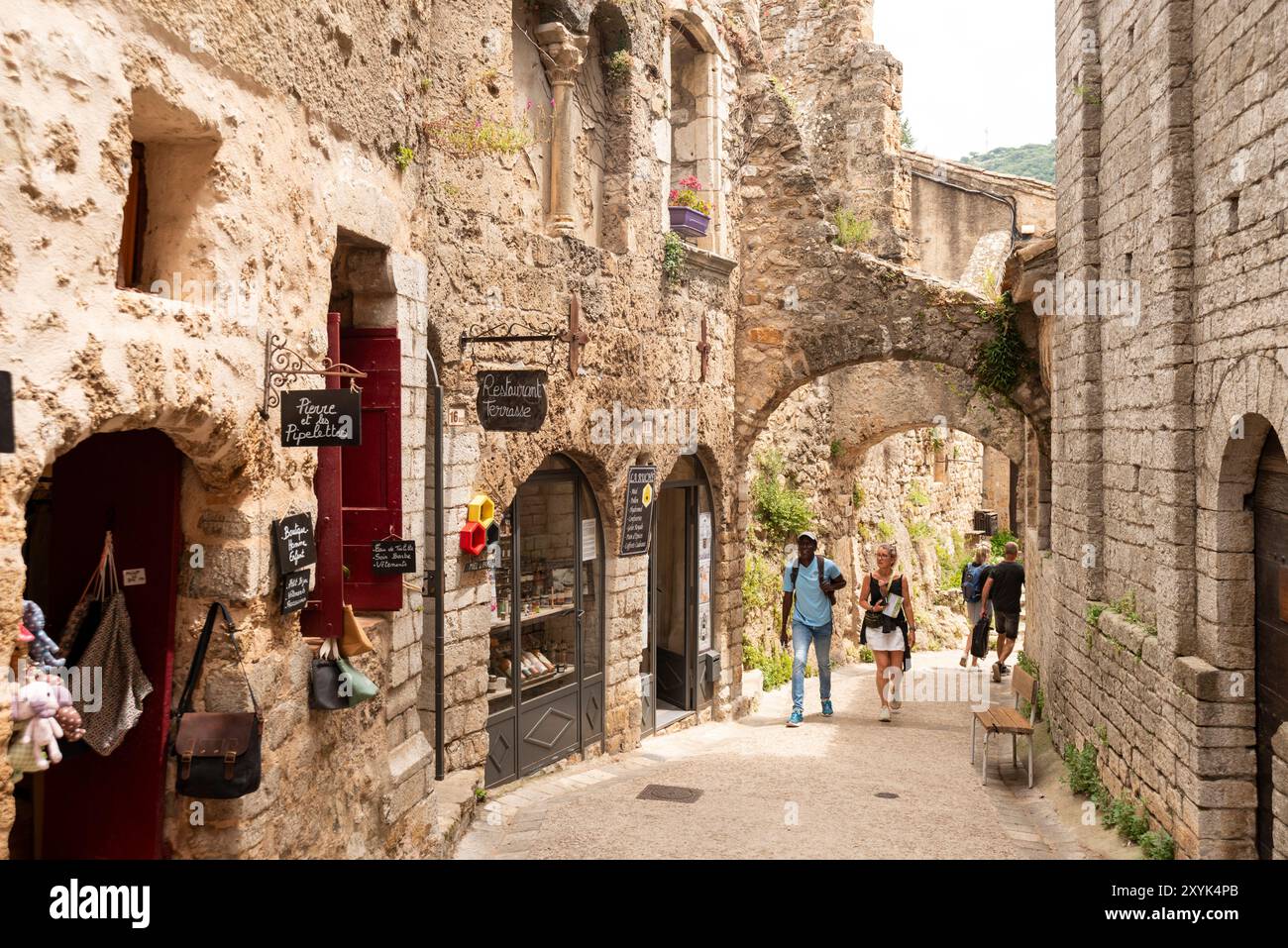 Narrow alleyway between old building, St Guilhem le Desert, Herault ...