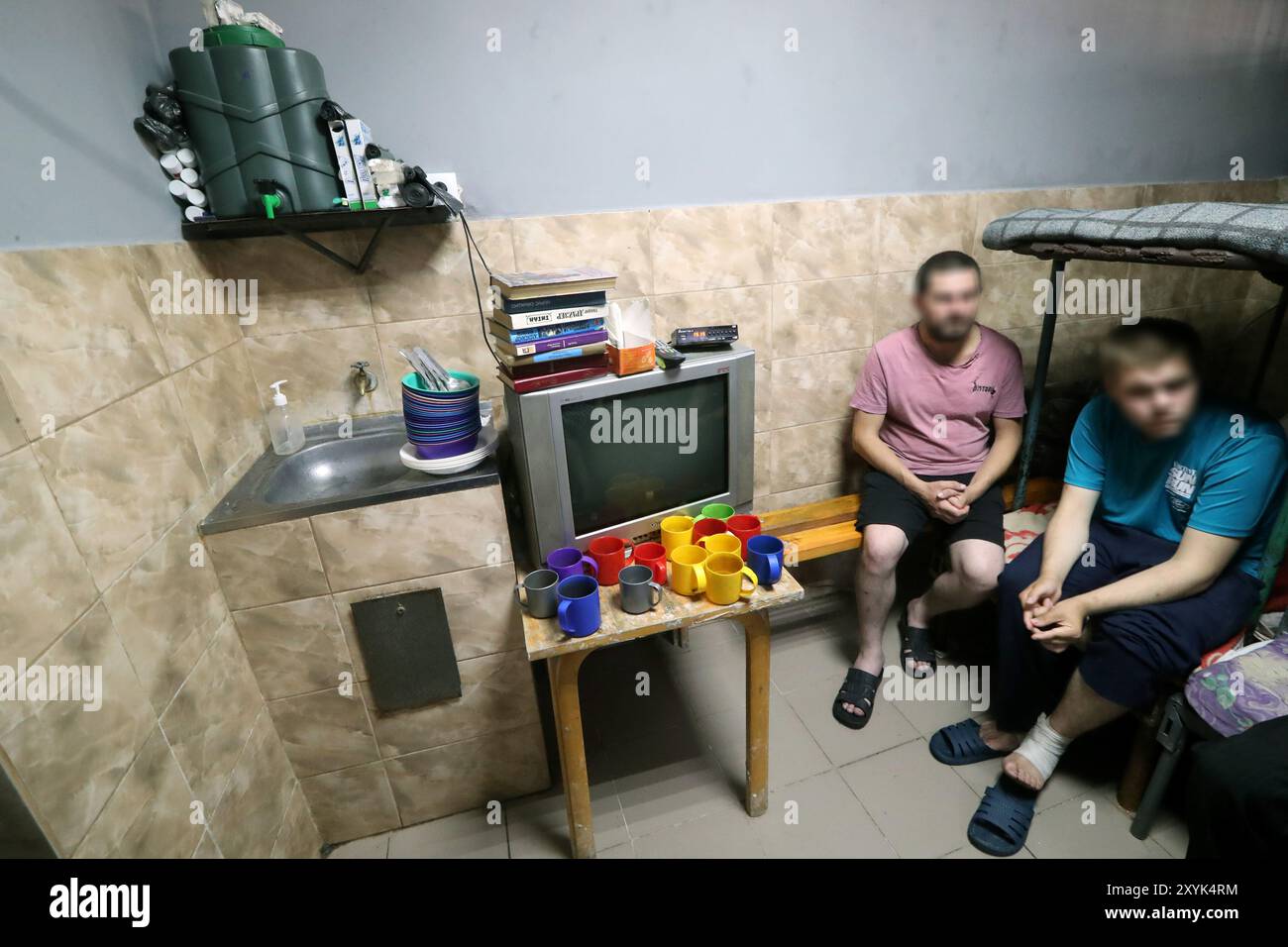 SUMY REGION, UKRAINE - AUGUST 28, 2024 - Captive Russian POWs sit on ...