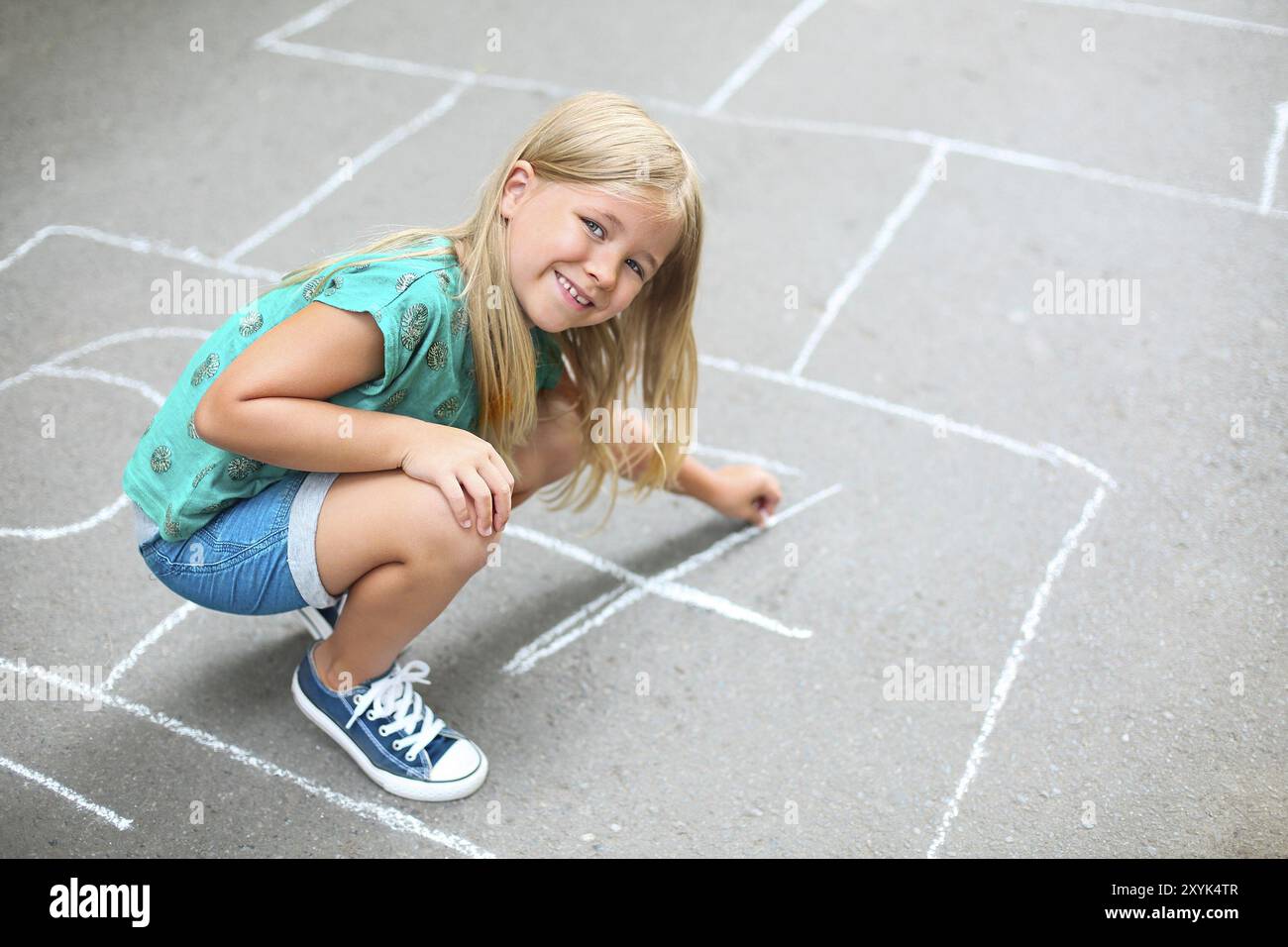 Kid playing hopscotch on playground outdoors, children outdoor ...