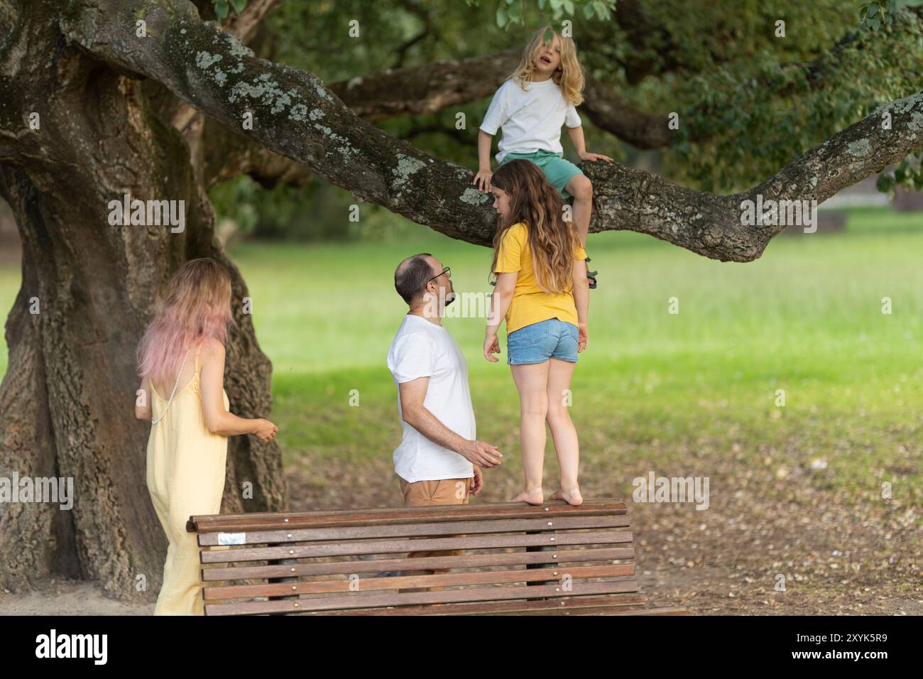 Father son climbing tree hi-res stock photography and images - Alamy