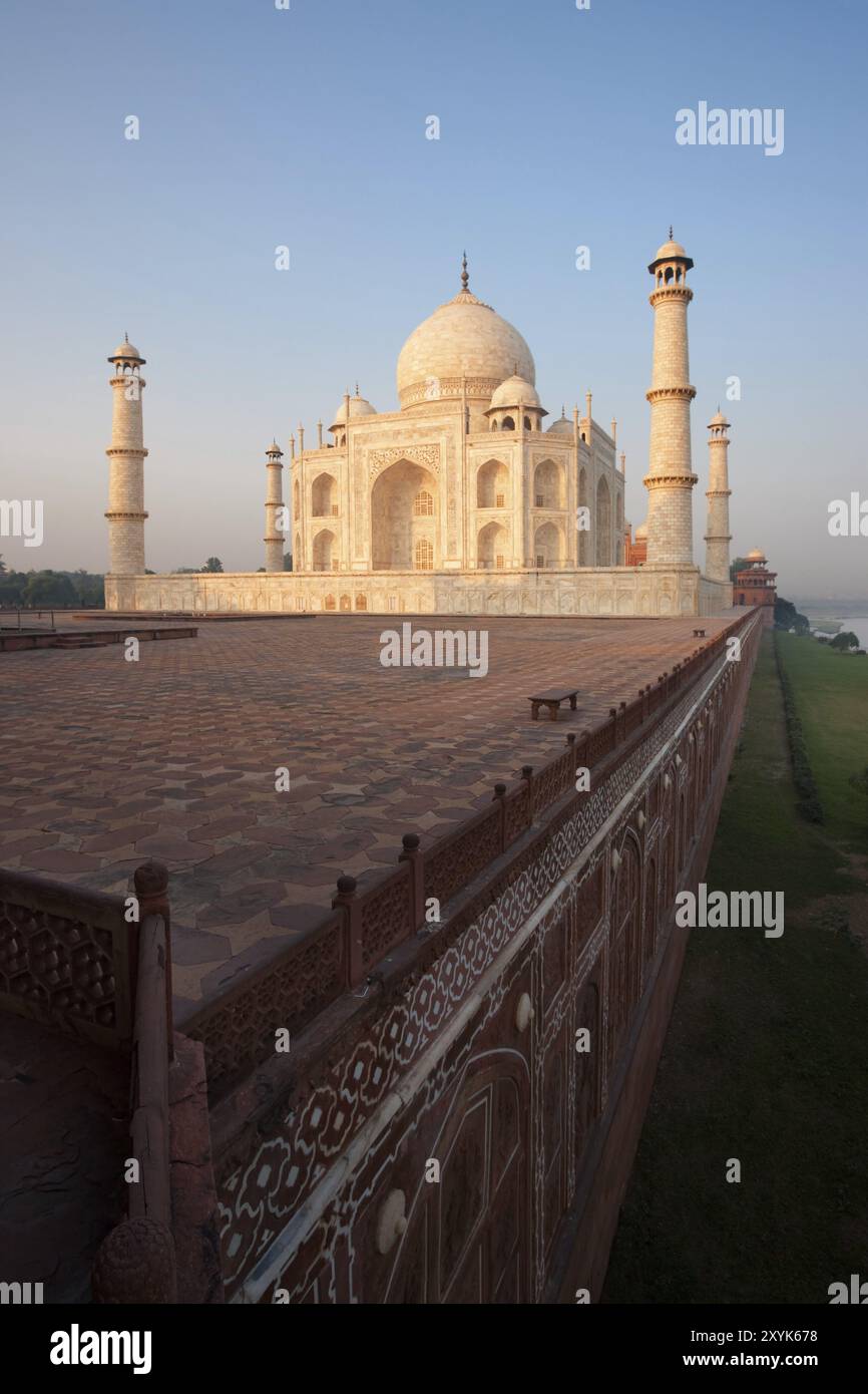 The red sandstone base of the Taj Mahal rises out of the bank of the ...