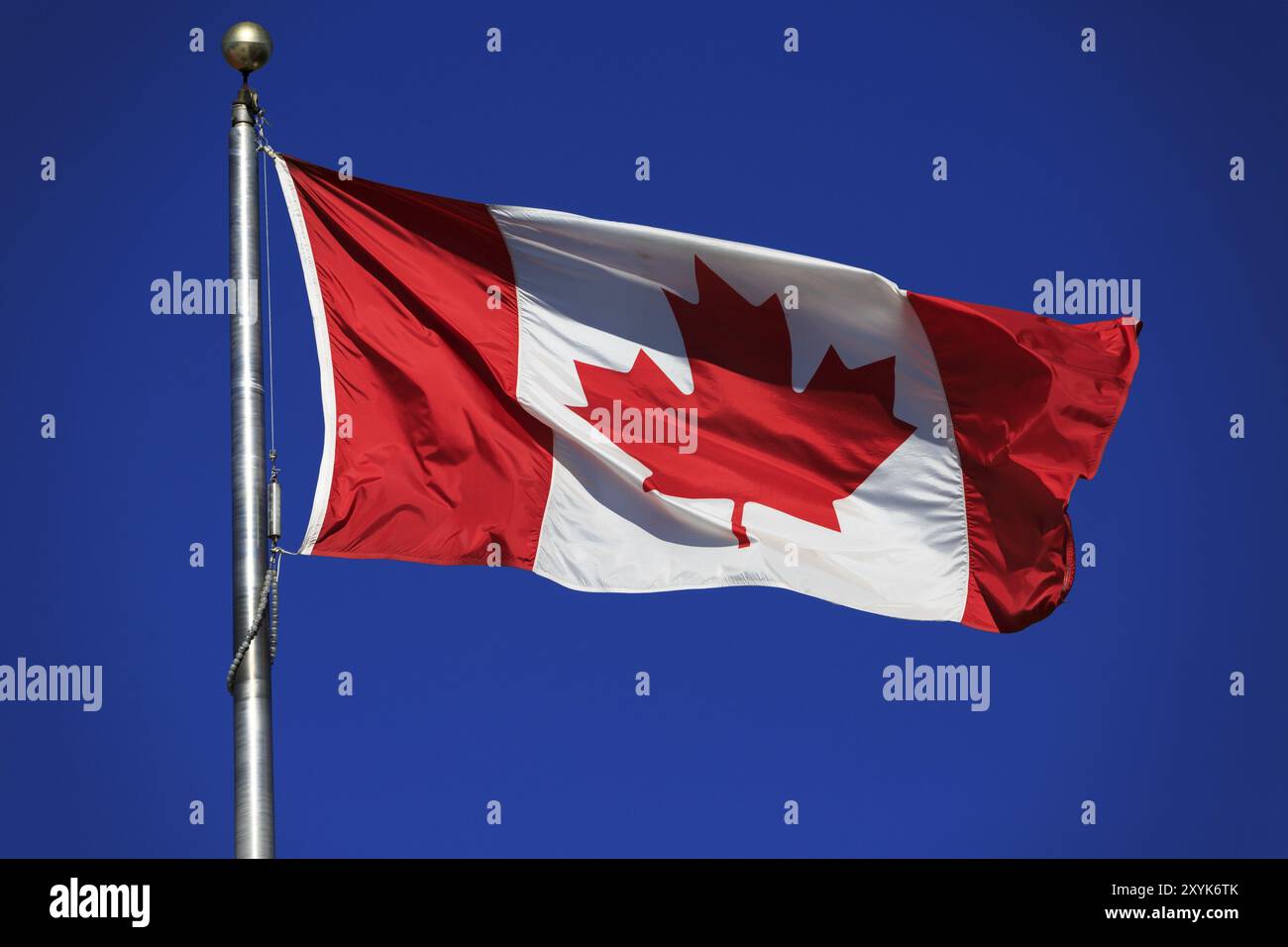 Canadian flag on a flagpole Stock Photo - Alamy