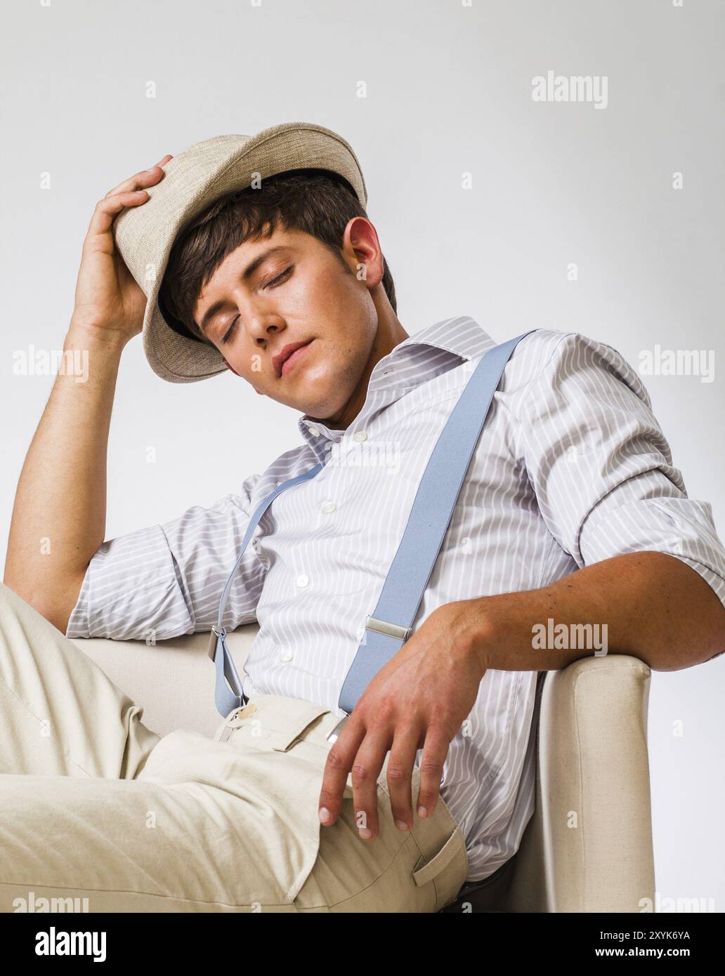 Man dozing in armchair hi-res stock photography and images - Alamy