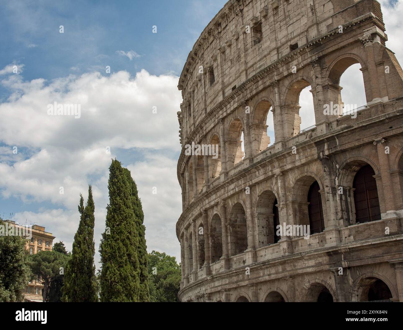 The historic Colloseum, an ancient Roman building with high arcades and ...