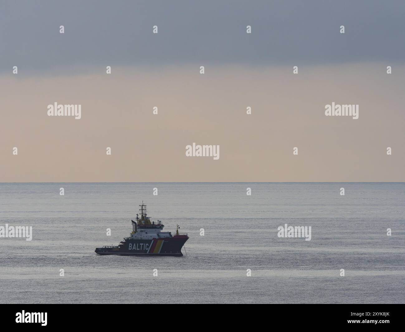 The deep-sea salvage tug Baltic anchors off the coast of Heligoland ...