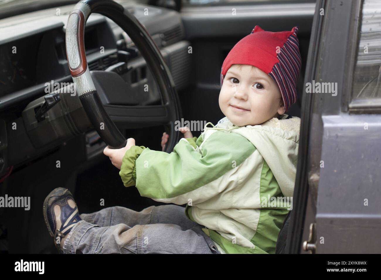 Little smiling child boy driving sport car vehicle Stock Photo - Alamy
