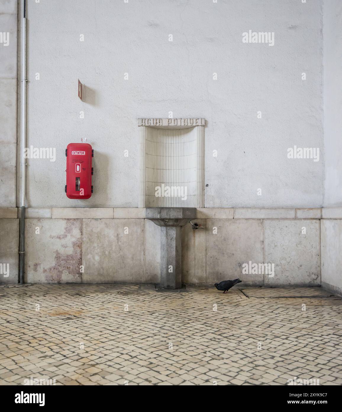 Fire extinguisher and drinking water fountain Stock Photo - Alamy