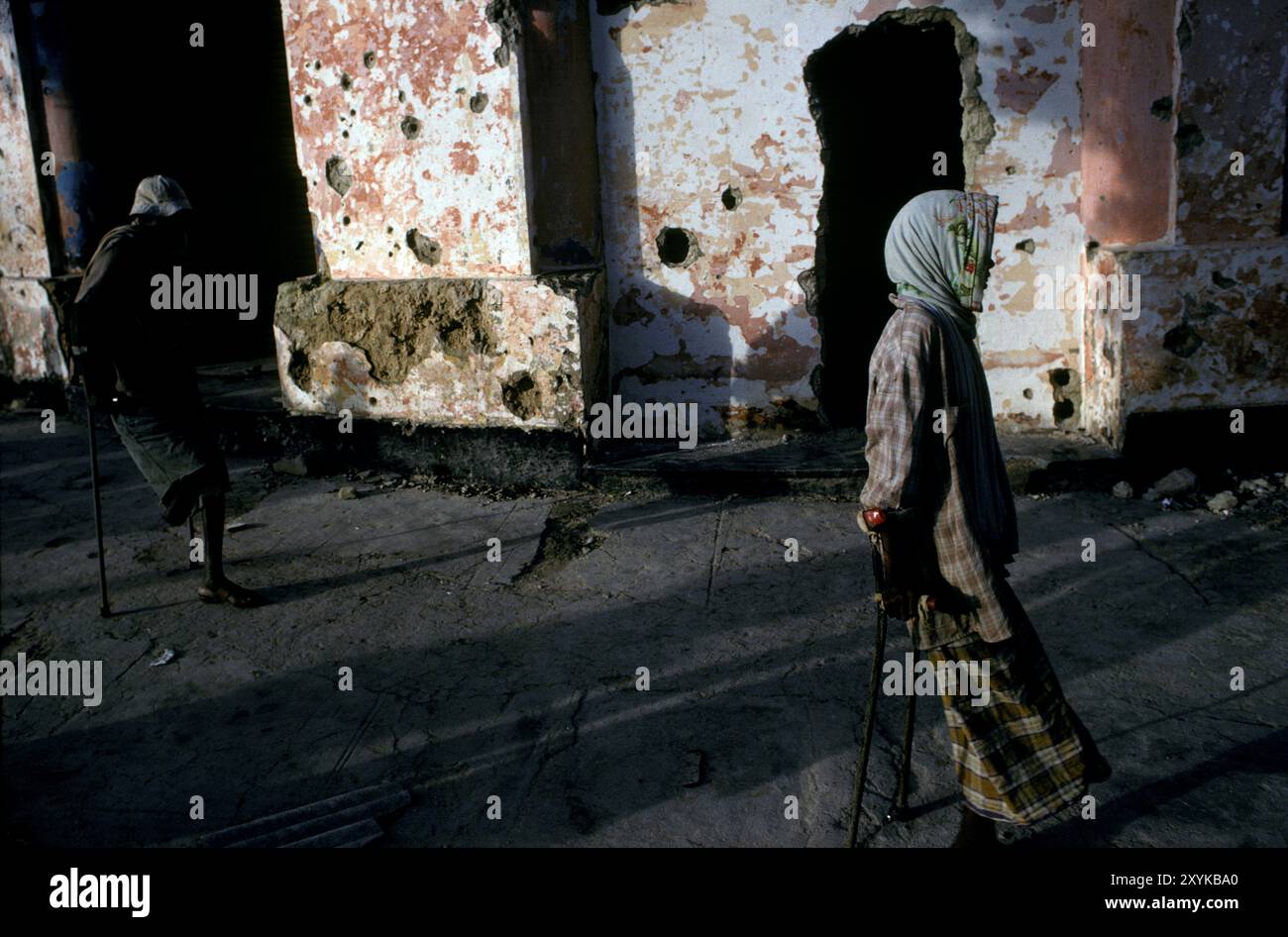Amputee men who lost legs in the fighting walk past war ravaged ...