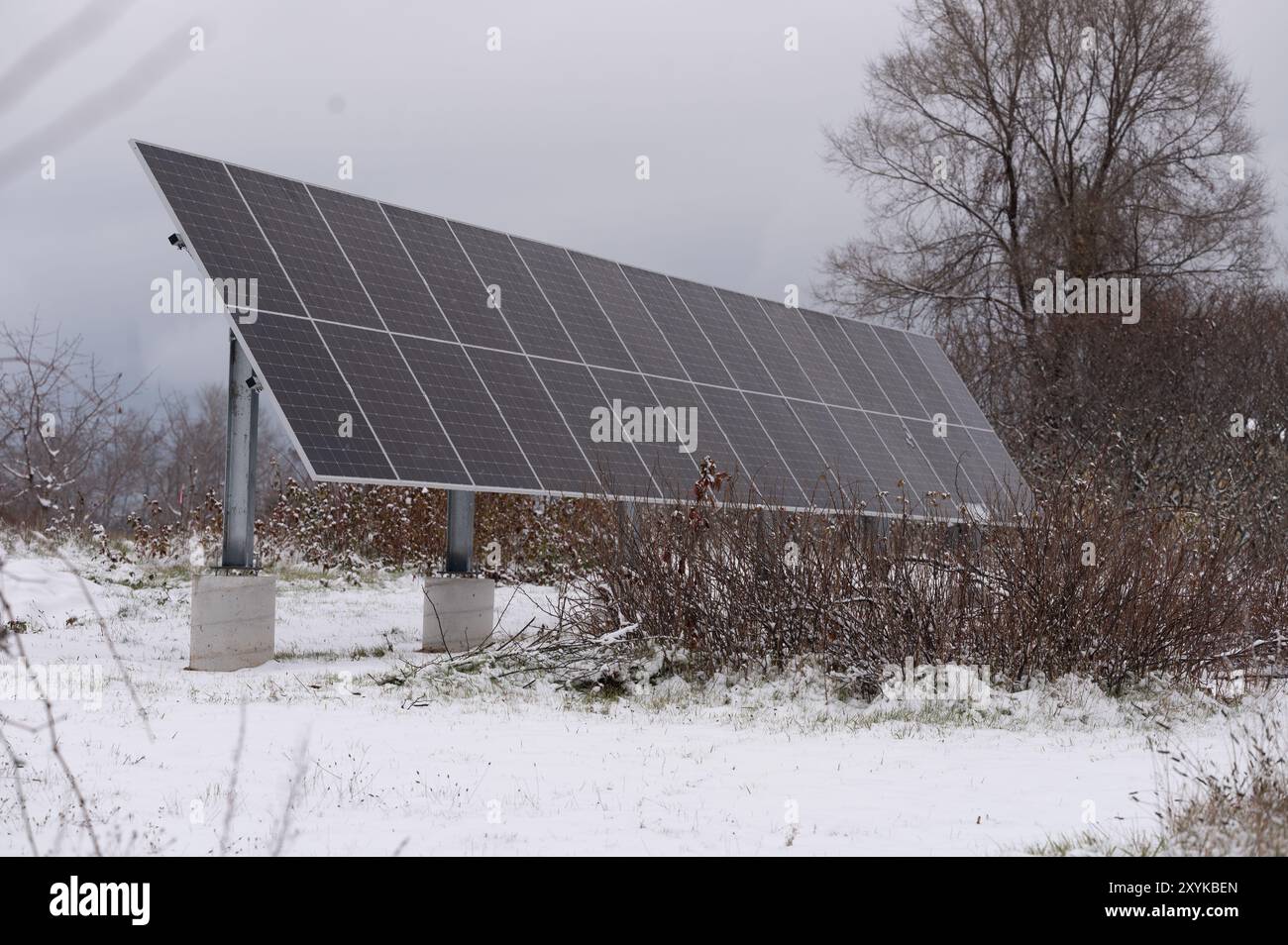 Winter scene of array of solar panels in rural environment Stock Photo ...