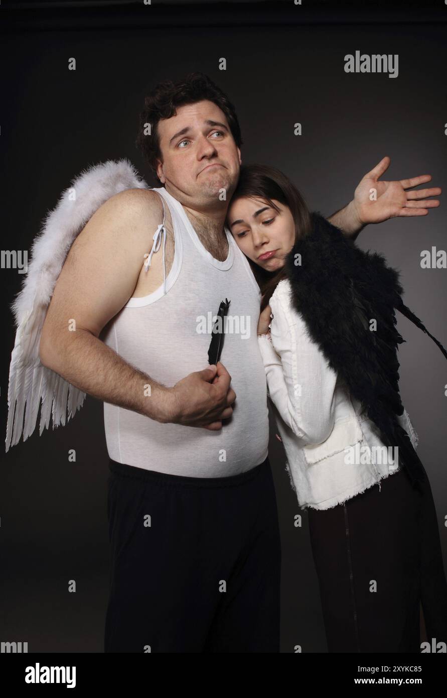 Mr. Angel and Mrs. Angel. Creepy character portrait Stock Photo - Alamy