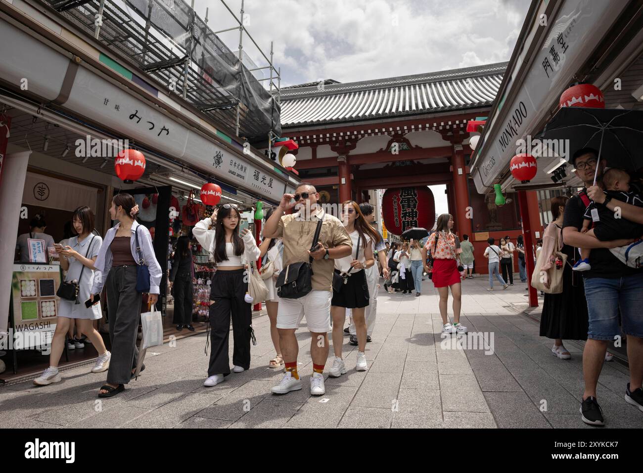 Tokyo, Japan. 29th Aug, 2024. Asian tourists walk inside Senso-ji ...