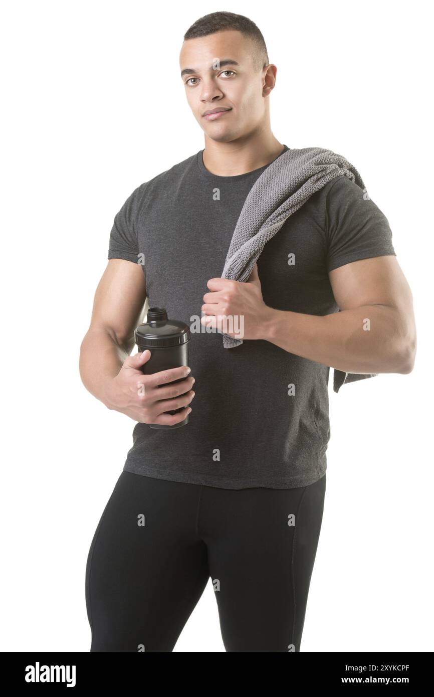 Man holding a protein shake after a workout in the gym, isolated in ...