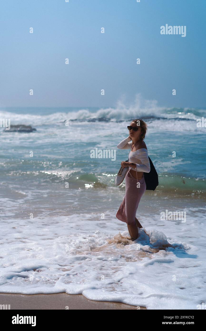 Rear view woman watching ocean hi-res stock photography and images - Alamy
