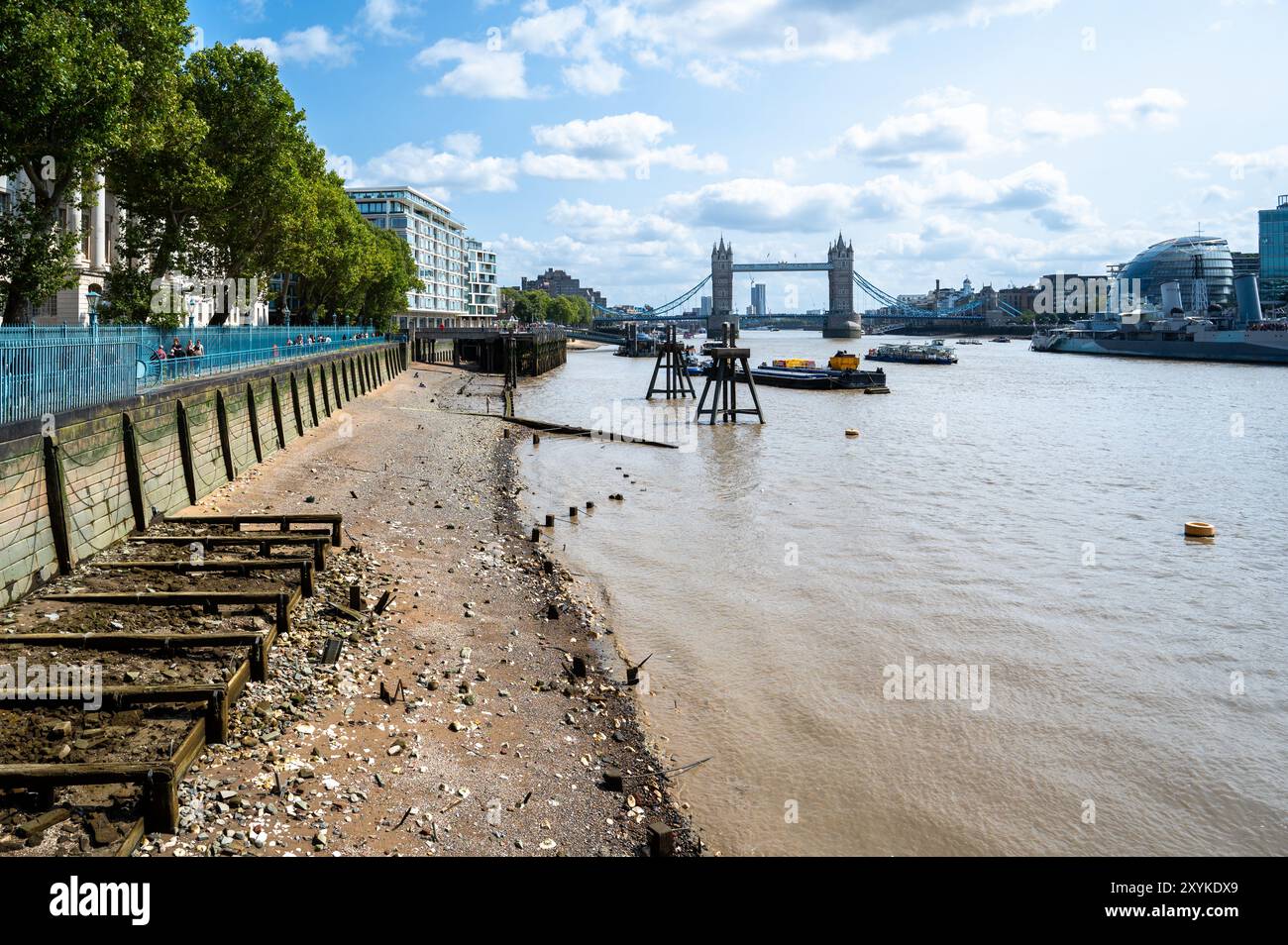 Low tide on River Thames with distant views of Tower Bridge, London ...