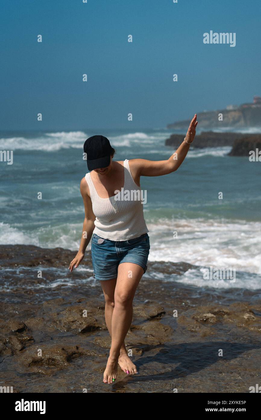 Rear view woman watching ocean hi-res stock photography and images - Alamy