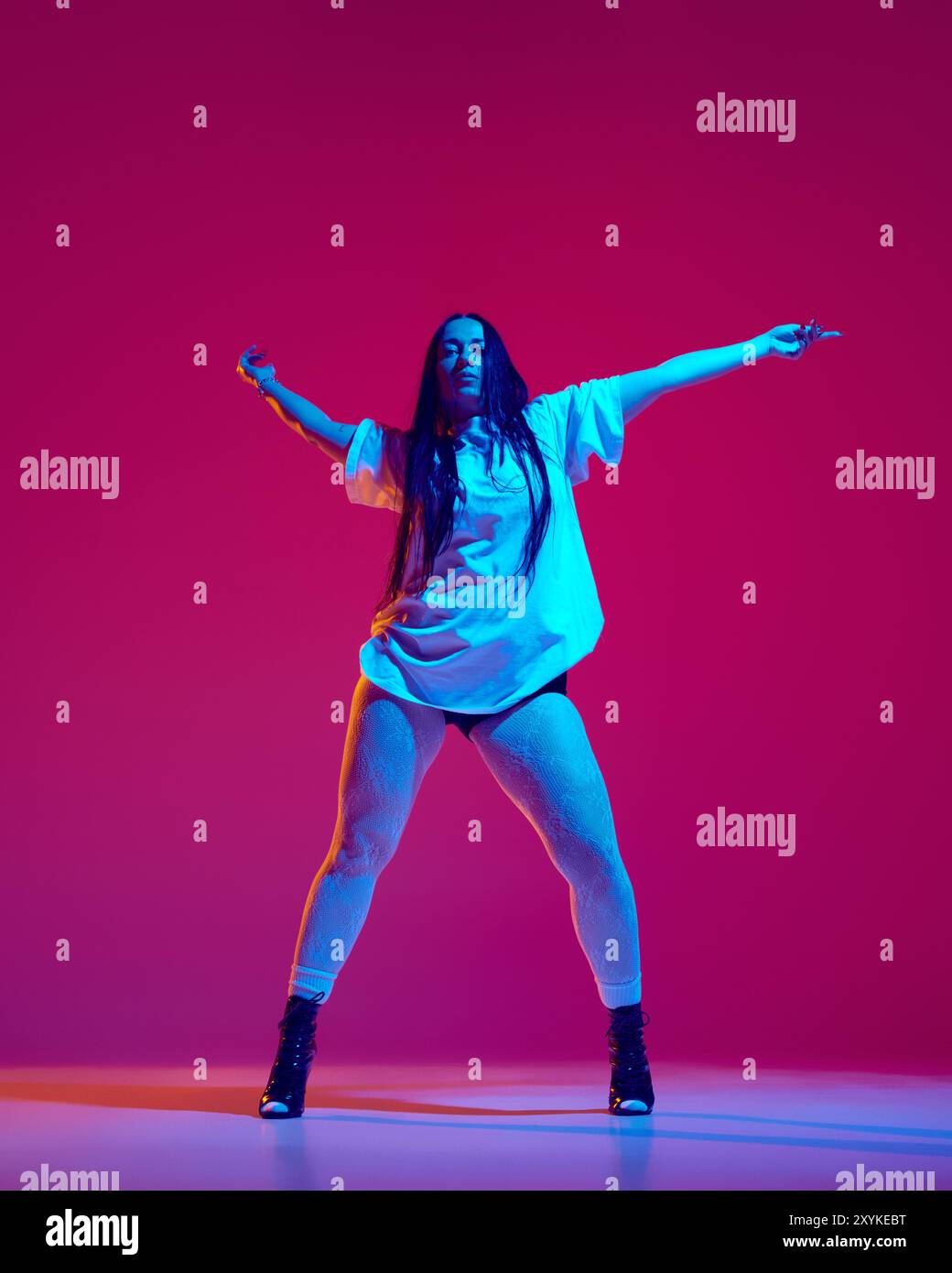 Blend of hip-hop and high heel dances. Beautiful young woman dancing ...