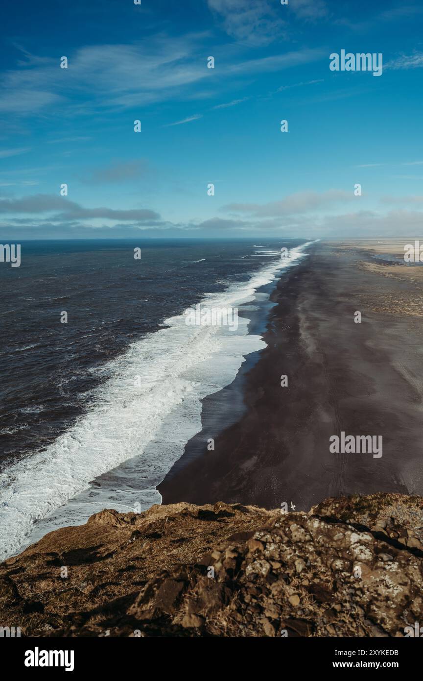 View of Dyrhólaey beach in Iceland with black sand and ocean waves ...
