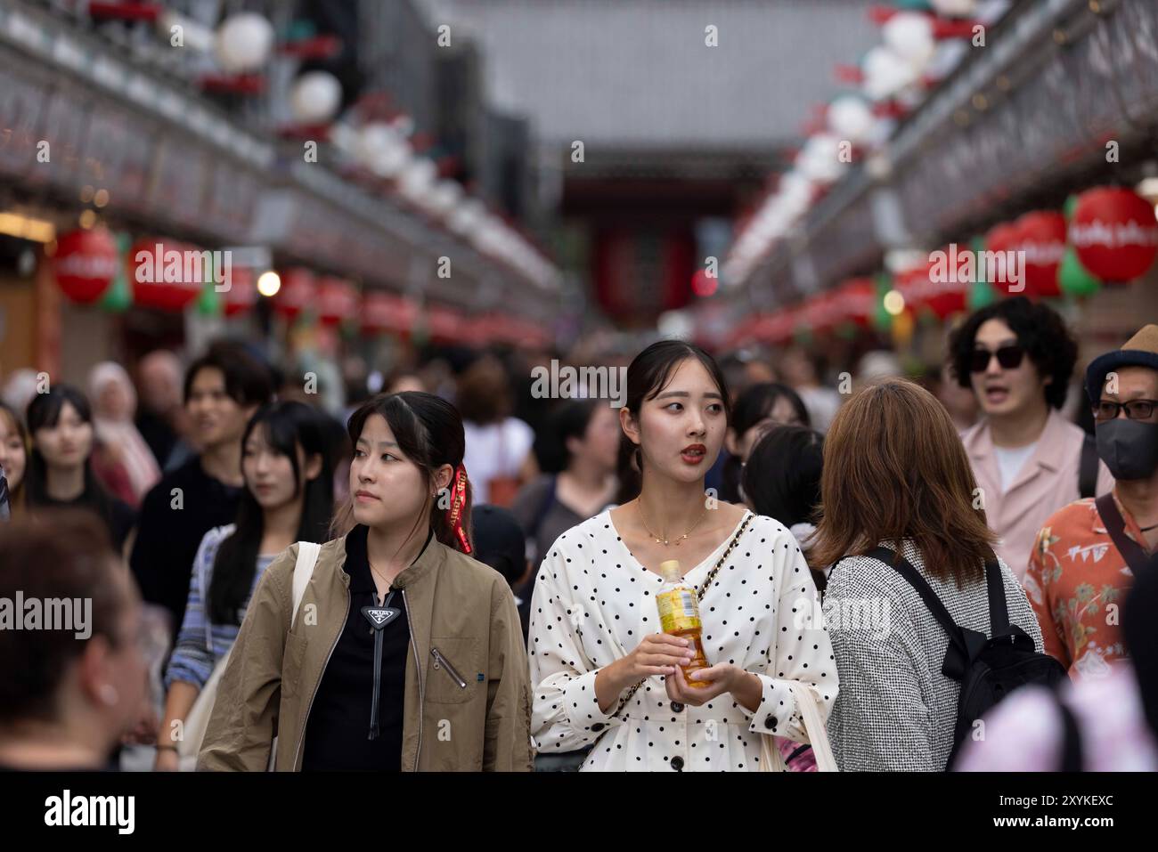 Tokyo, Japan. 29th Aug, 2024. Asian tourists walk inside Senso-ji ...