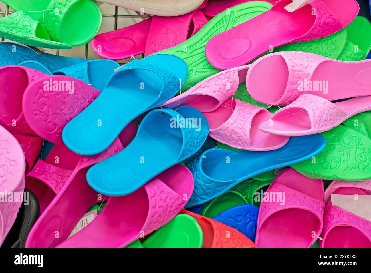 women's multi-colored flip-flops in a container in a supermarket Stock ...