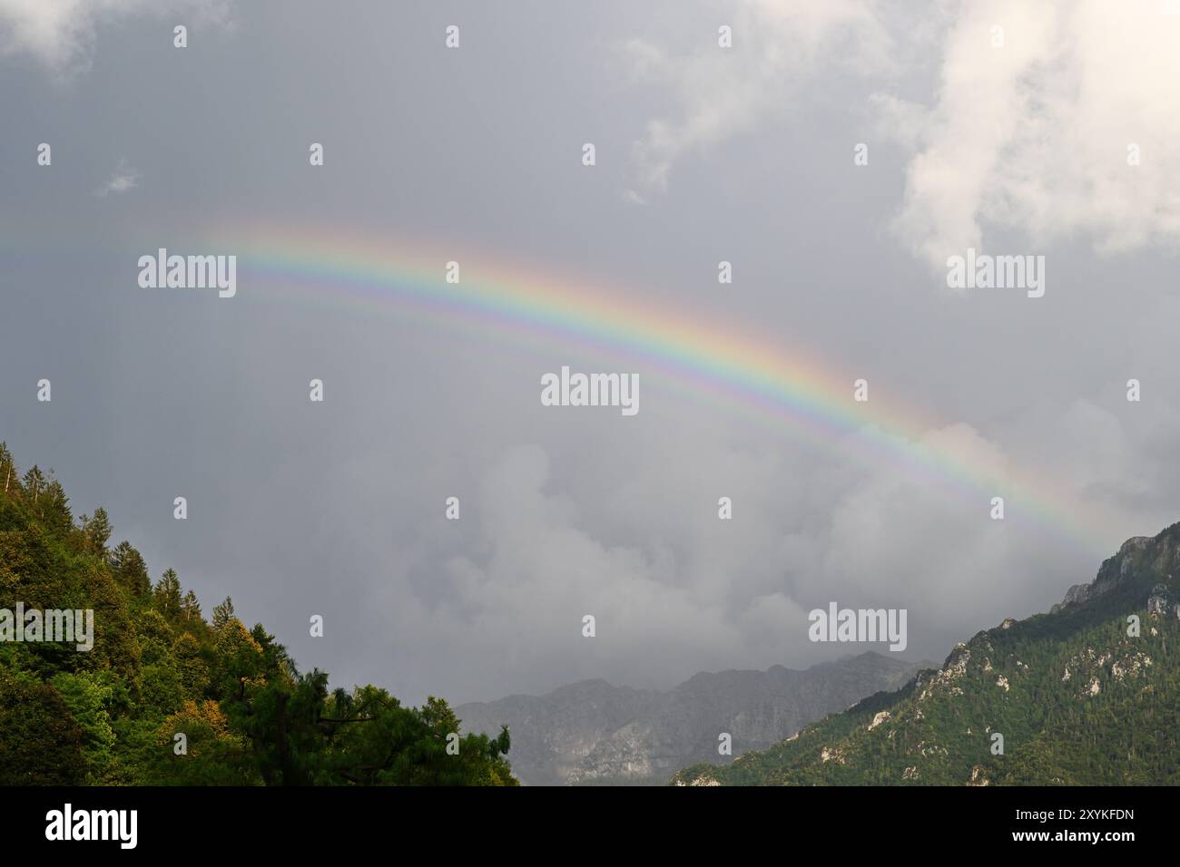 Panorama with rainbow over a mountains Stock Photo - Alamy