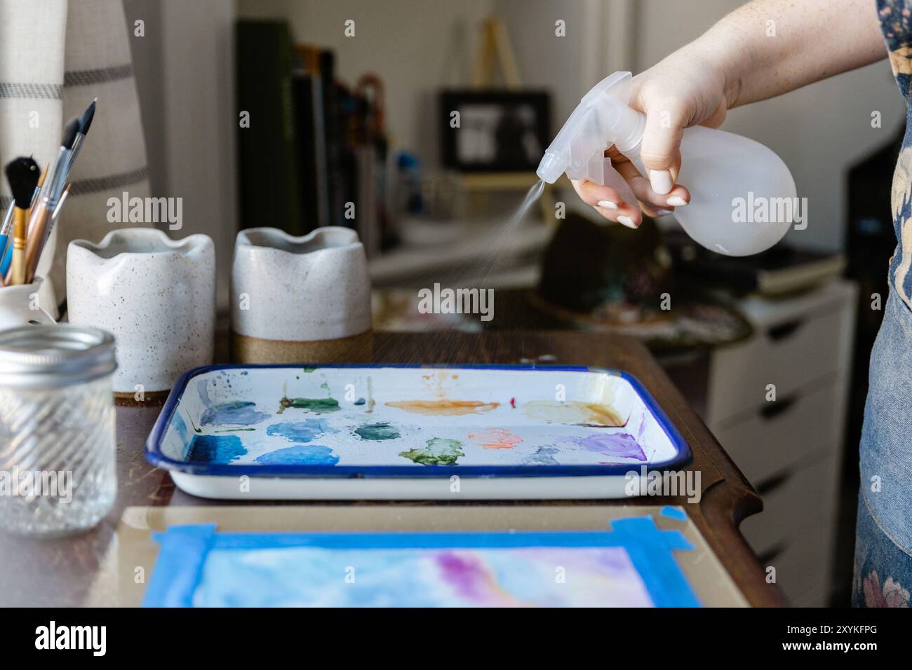 watercolor artist spraying paint palette Stock Photo - Alamy
