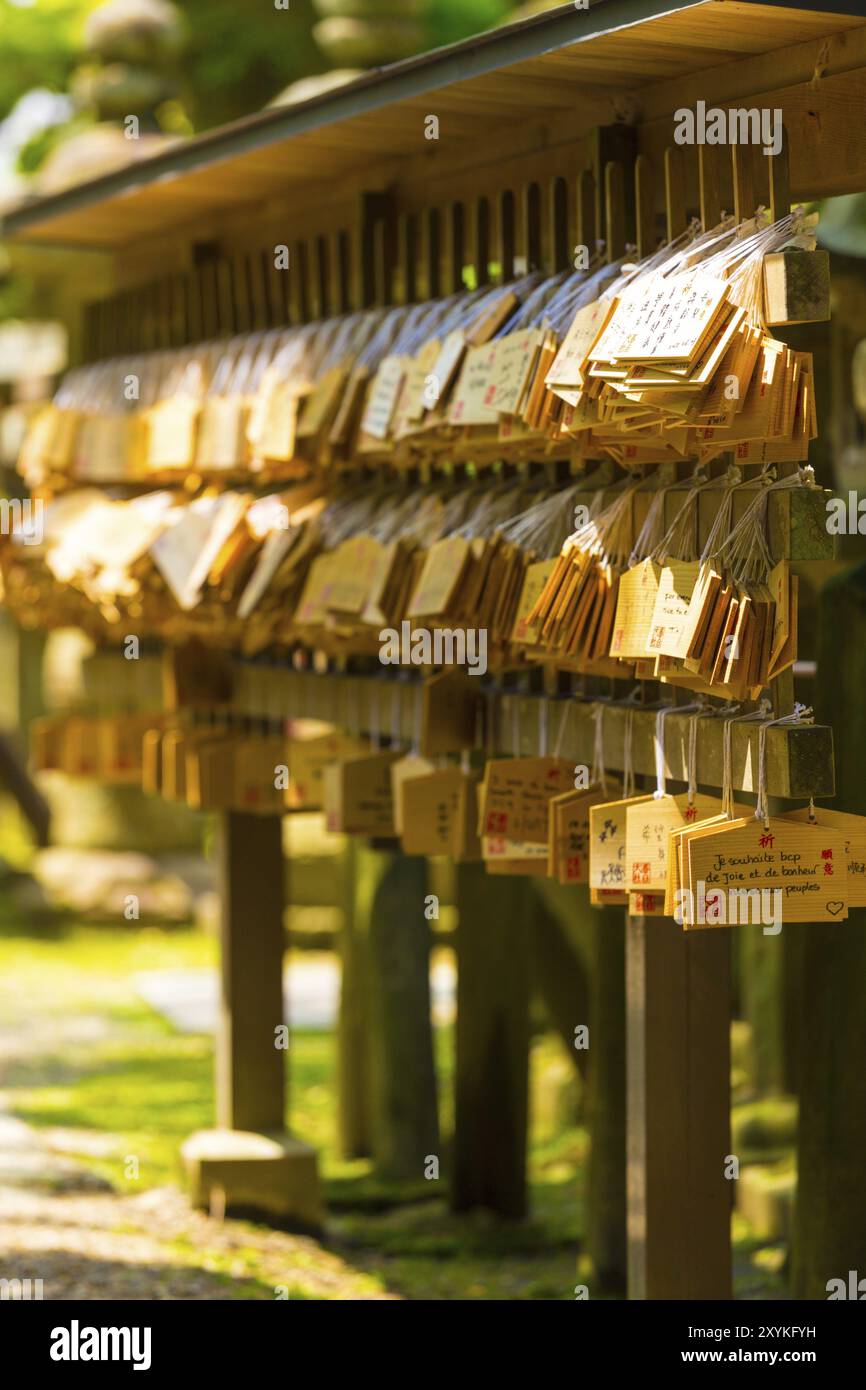 Many small signs or plaques called wooden ema tags carrying written ...