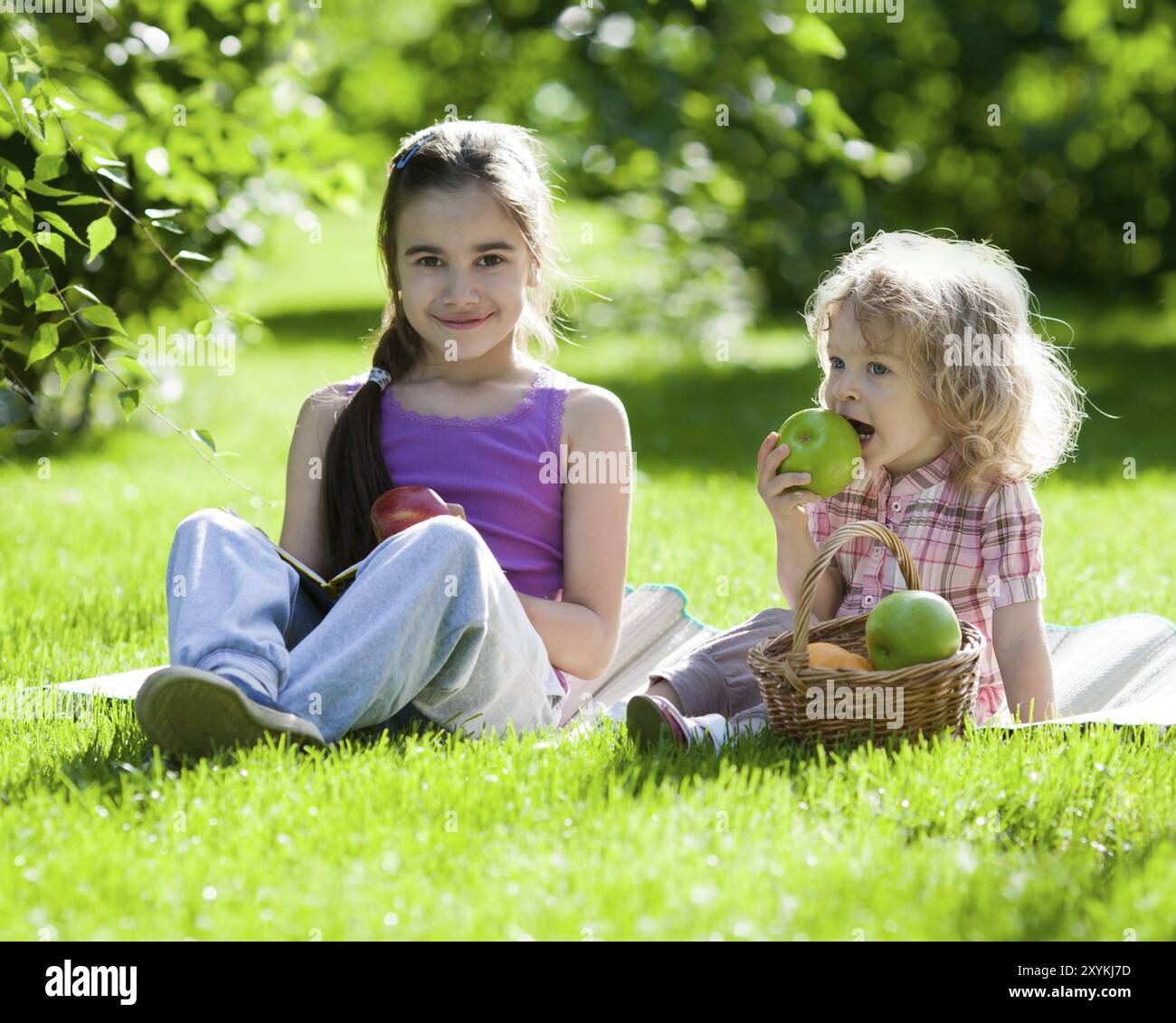 Happy children playing outdoors in spring park. Family picnic Stock ...