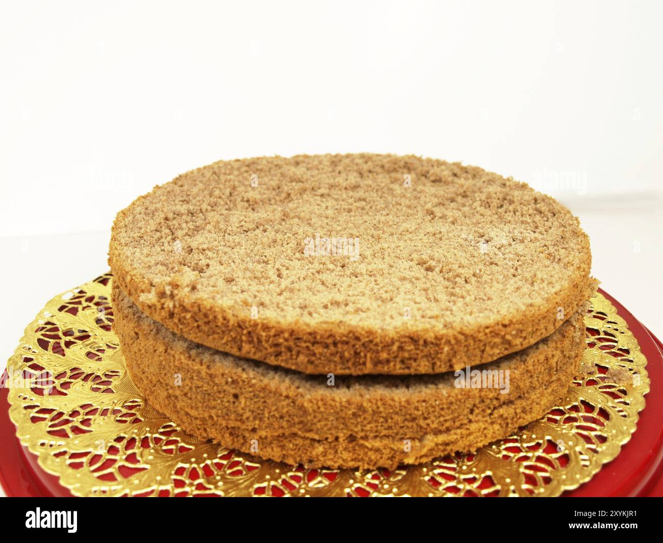 Chocolate layer cake, in slices, isolated on a golden paper Stock Photo ...