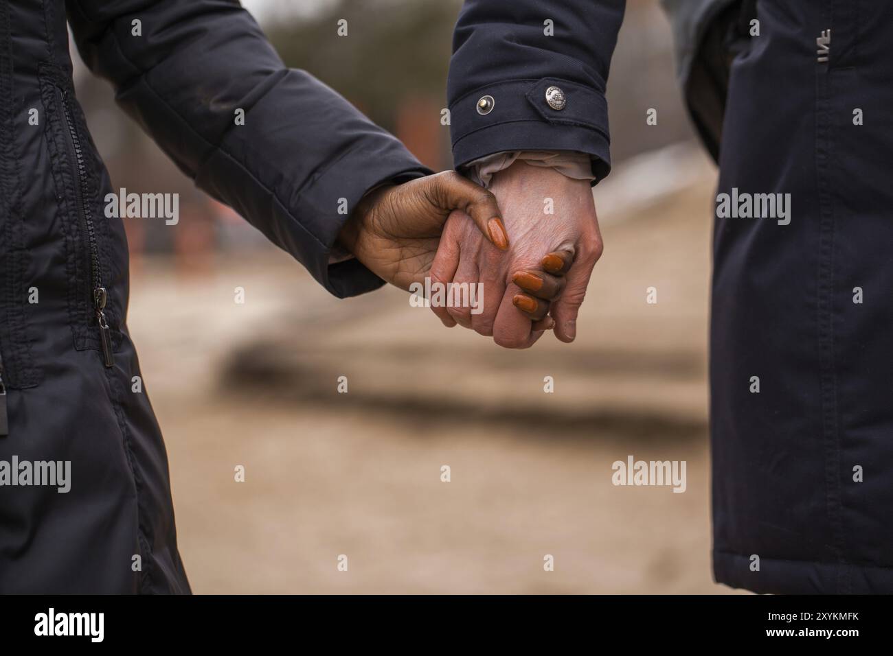 Two friends hold hands Stock Photo - Alamy
